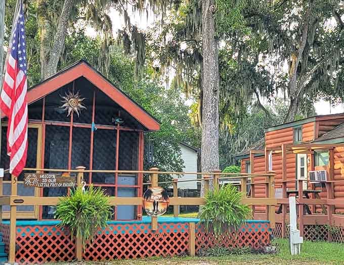 Screened porches and wooden cabins create a neighborhood where families gather to share stories and s'mores every evening.
