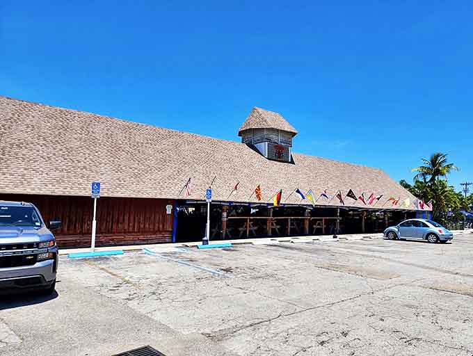This tiki bar's thatched roof and waterfront location scream island vibes louder than a parrot.
