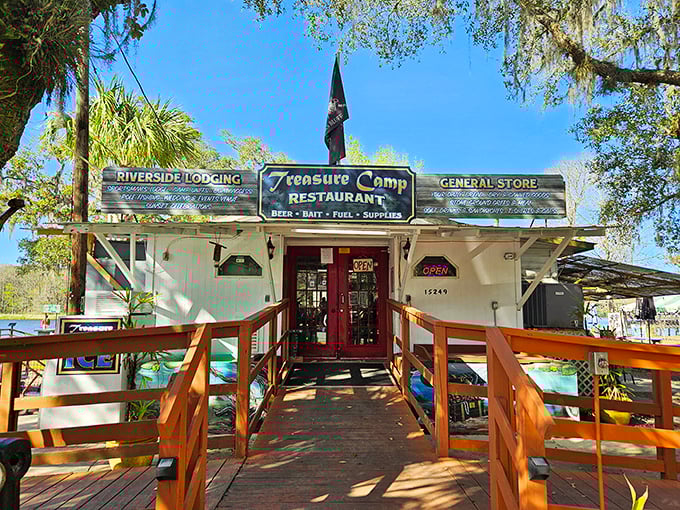 Treasure Camp's rustic wooden building and sign transport diners to Old Florida, where the legendary Suwannee River flows just steps away.