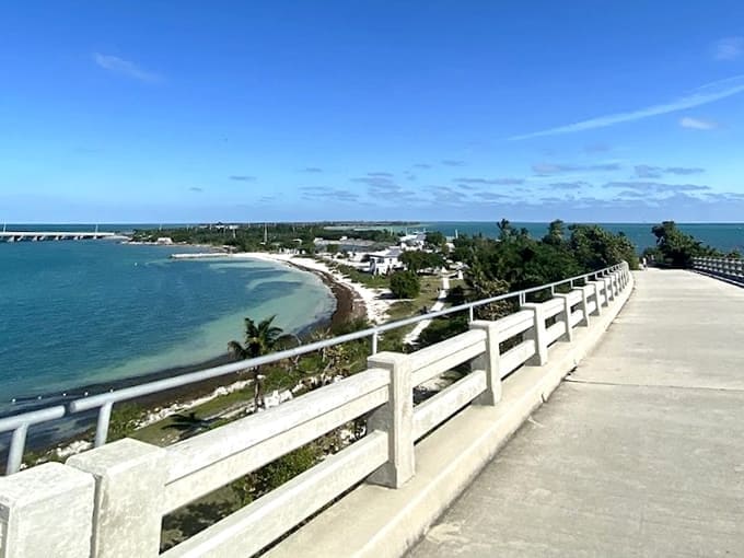 The old bridge stands as a monument to Florida's past while crystal waters below sparkle invitingly.