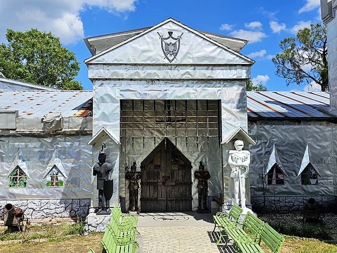 The entrance to Solomon's Castle features whimsical guardian statues, offering a first glimpse into the creative mind of its builder.