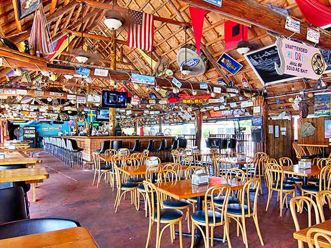 Inside, the ceiling is covered with colorful decorations and signs, creating a festive tropical atmosphere.