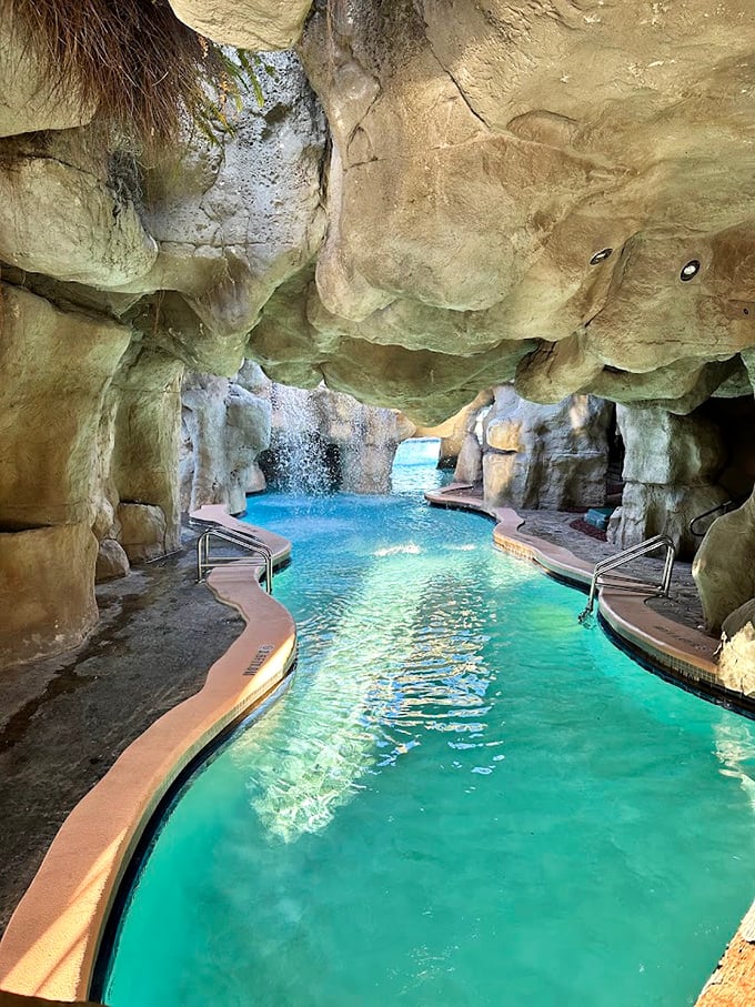 Swim through realistic cave formations where sunlight dapples the turquoise water, creating a magical underwater experience.