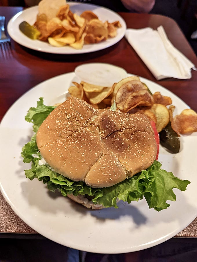 This isn't just a burger &ndash; it's a towering achievement of beef, lettuce, and bun, flanked by homemade potato chips.