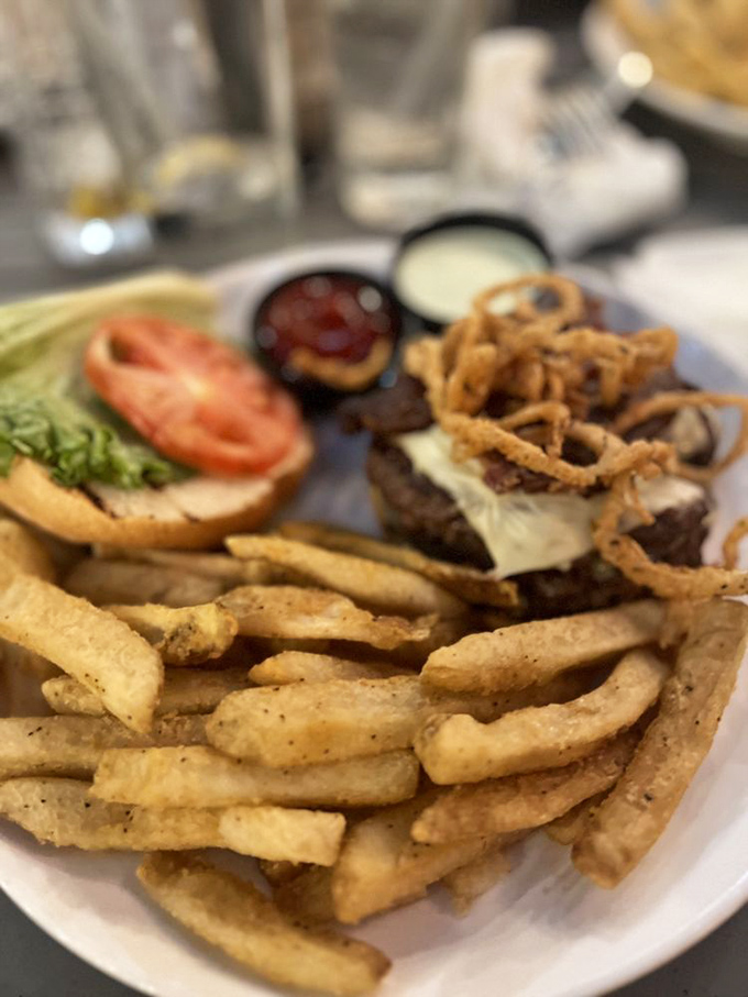 This isn't just a burger; it's a towering achievement of beef, cheese, and crispy onions that demands both hands and your full attention.