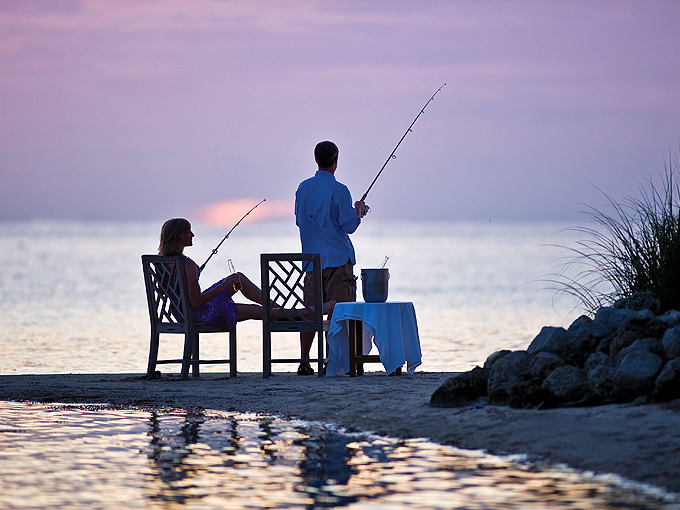 Honey, I think I've got a bite! Fishing at sunset creates memories that last longer than any souvenir t-shirt.