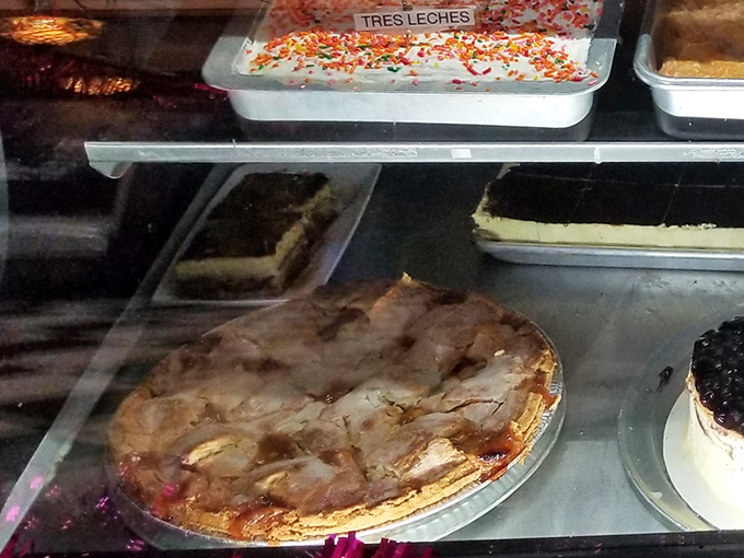 Homemade pies with flaky crusts and generous fillings await behind glass, tempting even the most determined dieters to surrender to sweetness.