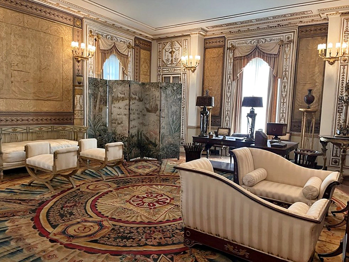 This reception room silently judges your IKEA furniture while showcasing tapestries that probably witnessed more history than your high school textbook.