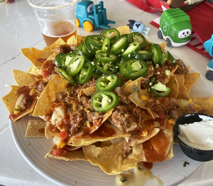 These loaded pulled pork nachos don't just cross the finish line&mdash;they take a victory lap with jalape&ntilde;os, cheese, and slow-roasted meat piled high.