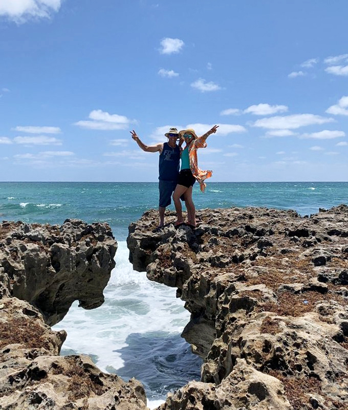 Standing triumphantly atop nature's bridge, these adventurers have found Florida's version of a perfect photo op, no filter required.