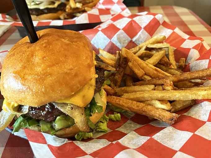 Pudgee's Burger stacks high with fresh toppings and perfectly cooked beef, making you wonder why you ever settled for less.