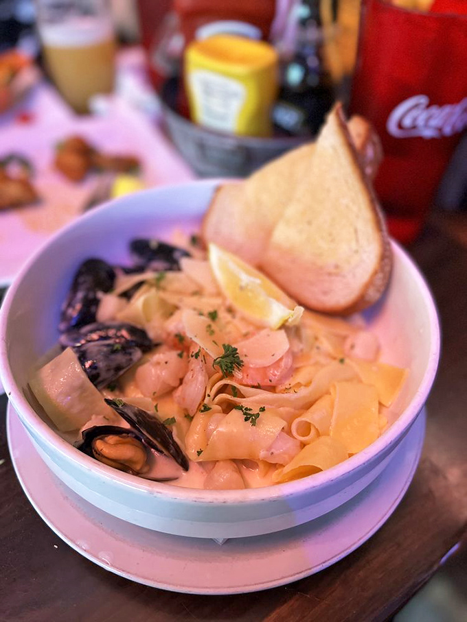 Seafood Alfredo that makes pasta feel like it's finally living its best life. Those mussels are practically waving hello!