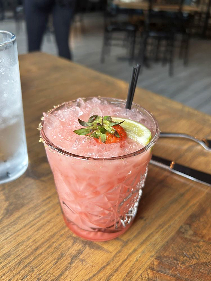 This isn't just any pink drink &ndash; it's summer in a glass, garnished with fresh strawberry and lime that brighten both the flavor and your day.