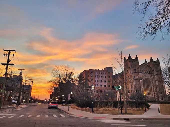 As day surrenders to dusk, the Law Quad's silhouette stands sentinel against a watercolor sky, its windows glowing like warm beacons.