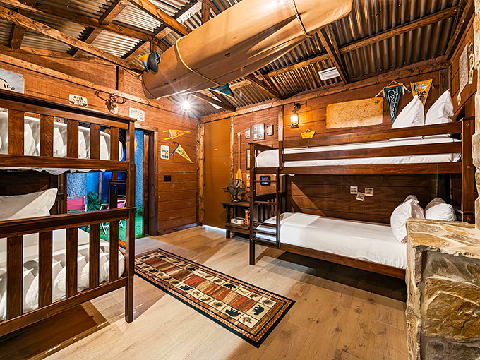 Childhood dreams come alive in this rustic bunk room where camp-inspired design meets luxury comfort for adventurers of all ages.
