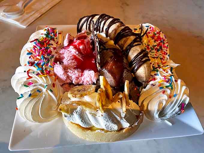 The classic banana split gets a steampunk makeover with artisanal ice cream, fresh whipped cream, and enough toppings to make your dentist weep with professional concern.