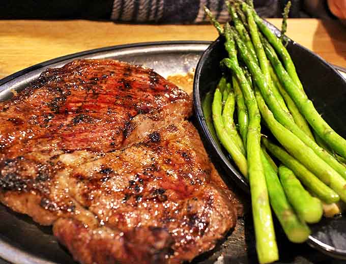 Steak with asparagus: A perfect partnership of protein and vegetable. The asparagus provides just enough virtue to justify steak indulgence.
