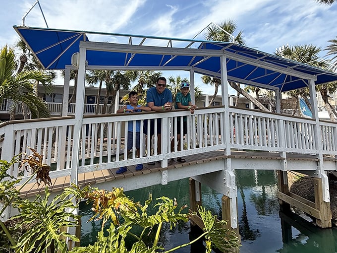Families create memories on the resort's charming bridge, where fishing stories grow taller with each telling and every catch.