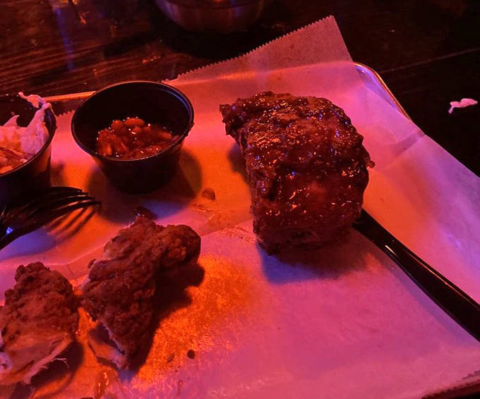 Golden-brown chicken tenders with a side of tangy sauce &ndash; simple food done right, proving that sometimes the classics are classics for good reason.