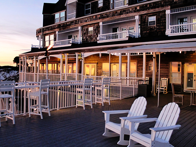 Beach Walk at Henderson Park Inn offers a perfect sunset dining experience, with its wooden deck extending toward the Gulf and comfortable seating for taking in the view.