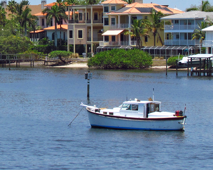 Waterfront homes in Cortez showcase the village's enduring connection to the sea, with boats ready for the next day's fishing.