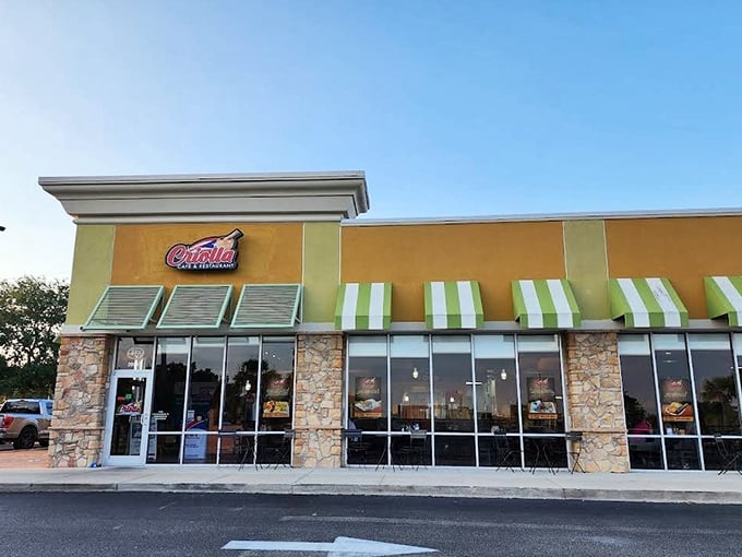 La Criolla's cheerful yellow exterior with stone accents hints at the sunny Caribbean flavors waiting inside this beloved Puerto Rican eatery.