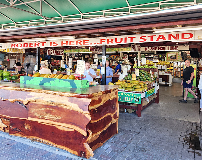 "Robert Is Here" fruit stand bursts with tropical colors and flavors, showcasing Florida's agricultural bounty in an open-air market.