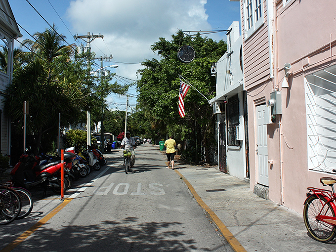 A slice of Key West life: pastel buildings, scooters parked curbside, and that unmistakable island vibe where everyone moves at vacation pace.