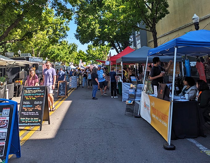 Visitors browse artisan goods at the Lakeland Downtown Farmers Curb Market, where small-town charm meets fresh local products in the heart of downtown.