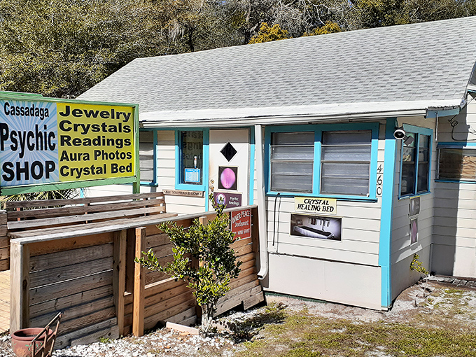 Bright signs advertise mystical services at this Cassadaga shop, where spiritual seekers come for guidance and metaphysical merchandise.