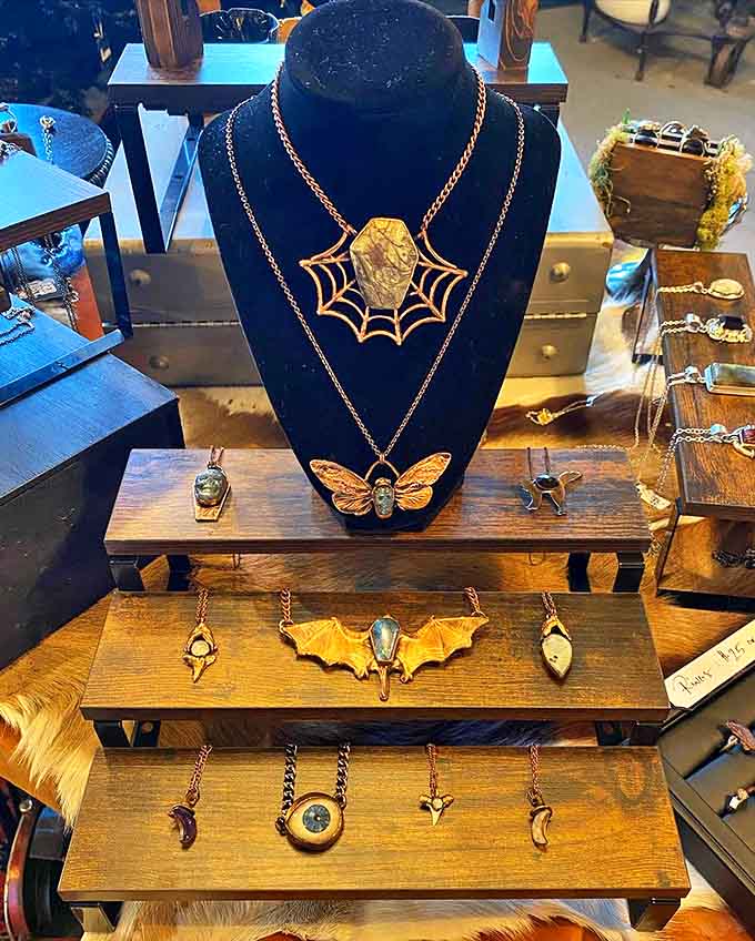 Nature meets artistry in these handcrafted copper and gemstone pendants, where delicate bat wings and spiderwebs become wearable gothic treasures.