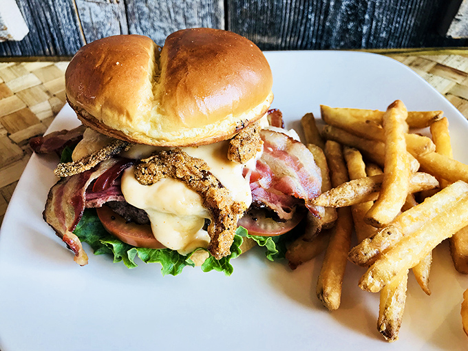 This isn't just any burger &ndash; it's a towering creation of beef, bacon, and toppings that demands both hands and possibly a strategy meeting.