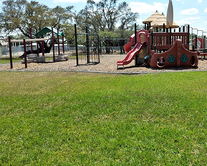 Charlie Brown Park offers playground equipment that actually looks fun rather than lawsuit-prevention devices, giving kids space to play while parents relax under shade trees that understand their assignment.