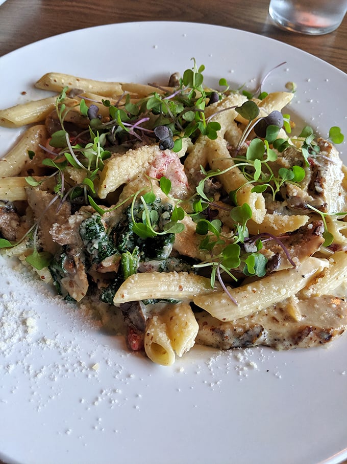 Pasta perfection achieved &ndash; tender penne tossed with fresh vegetables and microgreens creates a garden of flavors in every perfectly balanced bite.