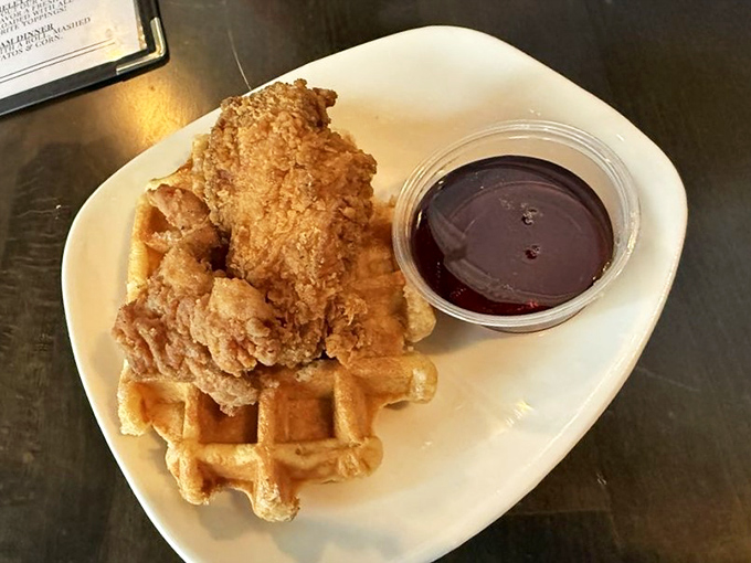 Golden Belgian waffles cradle 24-hour marinated fried chicken in a sweet-savory marriage that might just bring tears of joy.