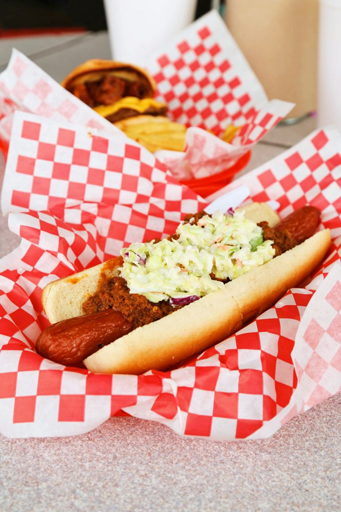 A proper chili dog should require multiple napkins and zero shame &ndash; this masterpiece delivers with its generous toppings and soft bun.