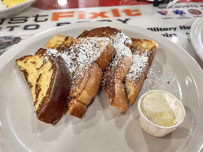 French toast dusted with powdered sugar like fresh Florida snow, ready to make your morning infinitely better than it was.
