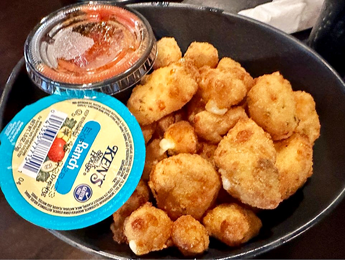 These garlic cheese curds aren't just appetizers – they're little golden nuggets of joy that stretch dramatically with each delicious pull.