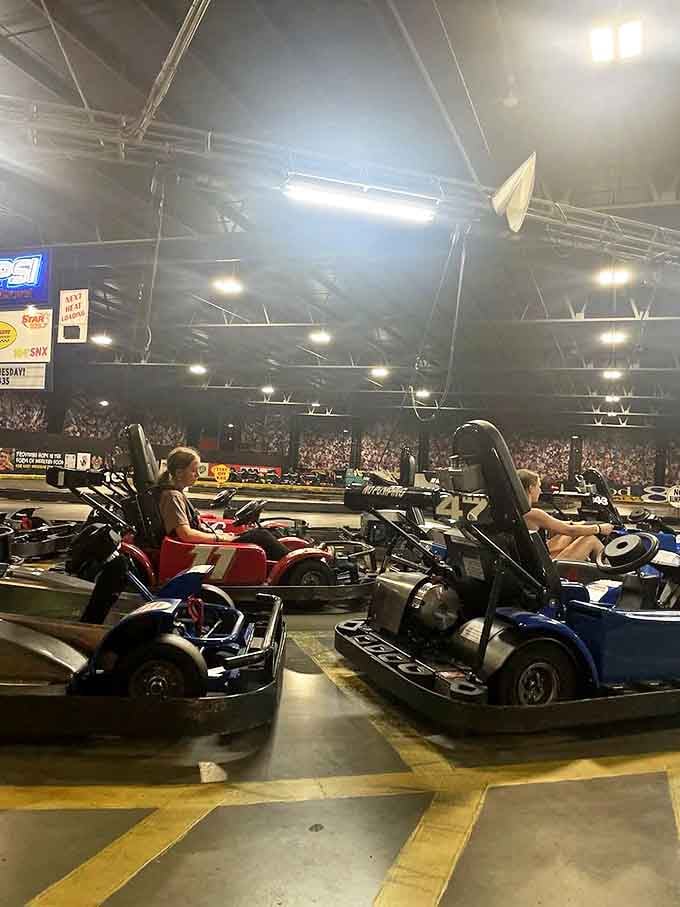 Inside go-karts: Speed demons young and old prepare for glory on the indoor track, where family bragging rights are won one lap at a time.