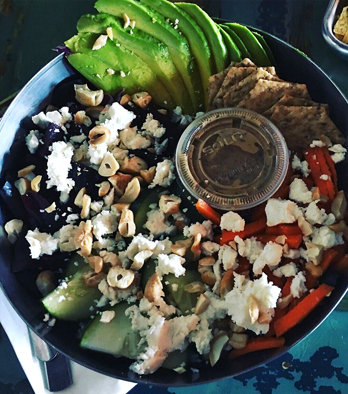 Fresh greens, vibrant vegetables, and what appears to be feta create a salad that doesn't feel like punishment for yesterday's dessert choices.