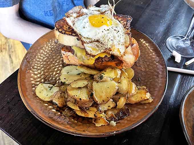 Breakfast reaches new heights with this towering creation&mdash;a burger crowned with a perfectly fried egg atop golden potatoes that glisten with herbs and butter.