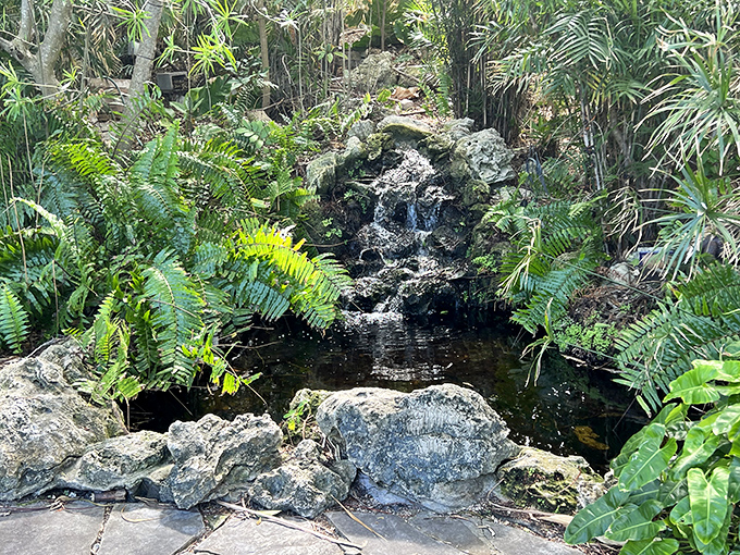 A hidden oasis nestled among ferns and tropical foliage, this waterfall creates the perfect soundtrack for garden meditation.
