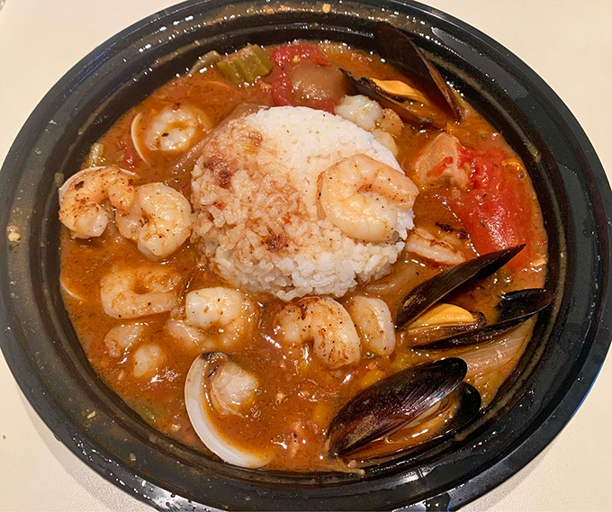 A coastal Florida symphony in a bowl, where plump shrimp and tender mussels dance around a throne of perfectly cooked rice.
