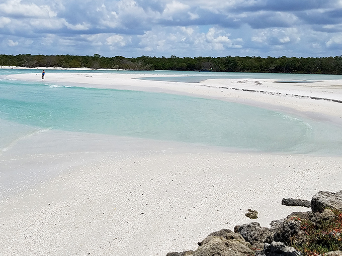 The kind of beach where time slows down and even the water seems reluctant to rush, lapping gently at powder-white shores.