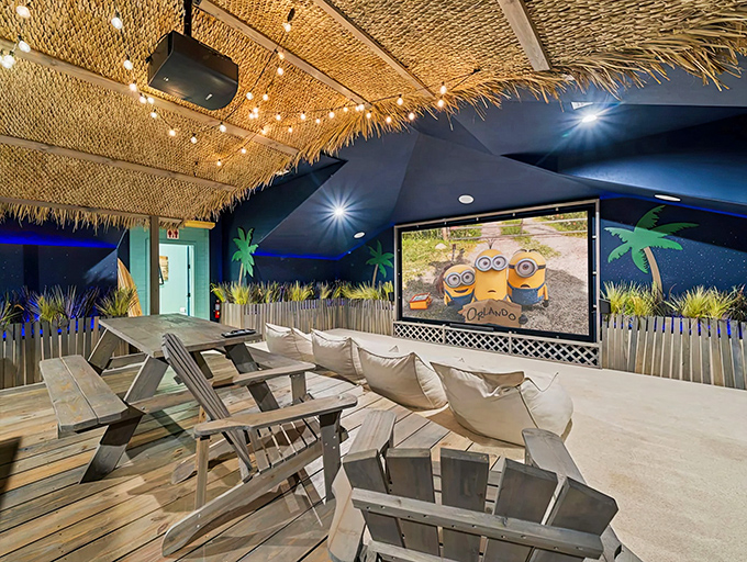 Movie magic happens under thatched roofs and string lights in this tropical theater room that transforms film night into vacation highlight.