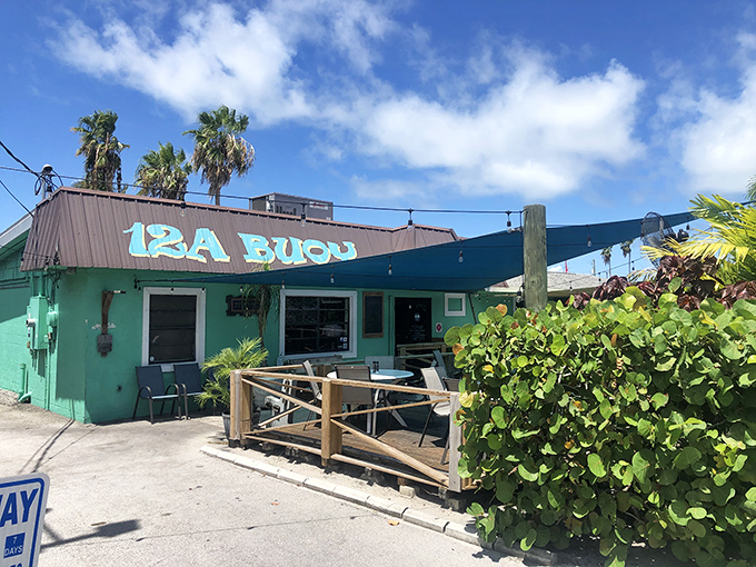 12A Buoy's vibrant turquoise exterior stands out in Fort Pierce, a colorful beacon for seafood lovers seeking the freshest catch.v
