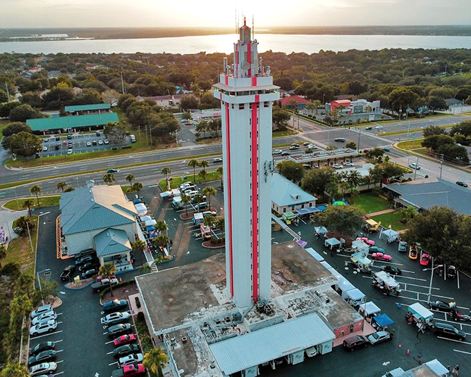 The Florida Citrus Tower stands tall against the sunset, a candy-striped sentinel watching over Clermont's rolling hills.