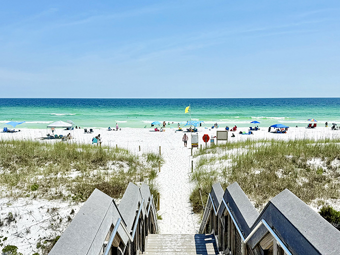Henderson Beach State Park's pristine white sand beach stretches toward the horizon, with emerald waters creating a stunning contrast against the sugar-white shoreline.