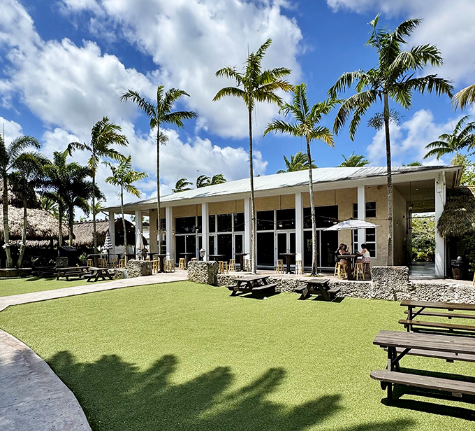 Palm trees frame the elegant entrance to Schnebly Redland's Winery, where tropical fruits become sophisticated wines.