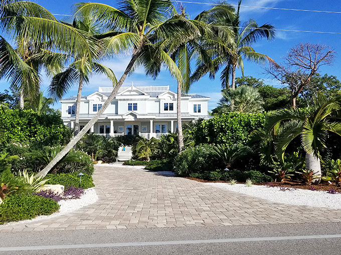 Island homes on Captiva stand like tropical dreams come true, their white porches and pastel colors framed by swaying palms.
